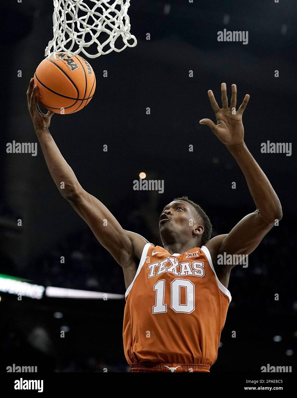 Texas forward Dylan Disu puts up a shot during the first half of the ...