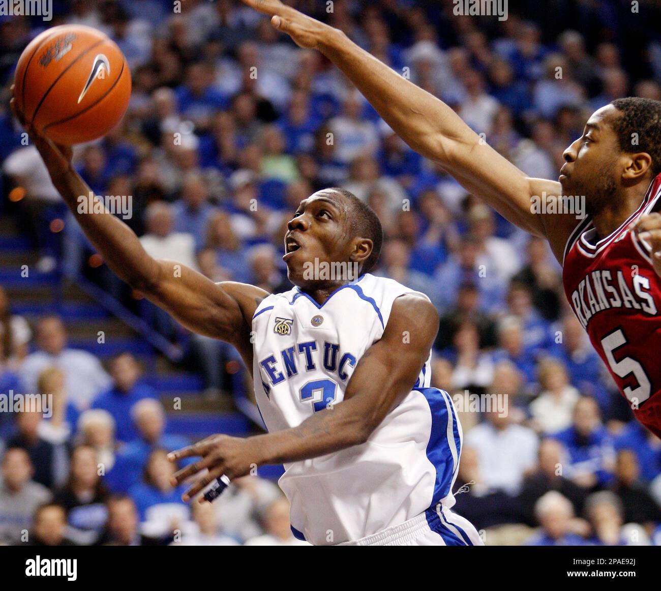 Kentucky's Ramel Bradley, left, puts up a shot in front of Arkansas ...
