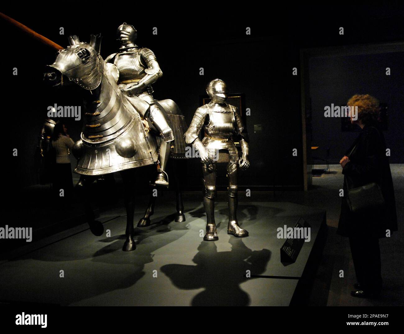 A visitor looks at horse armor from 1505-1510, saddle and stirrups from ...