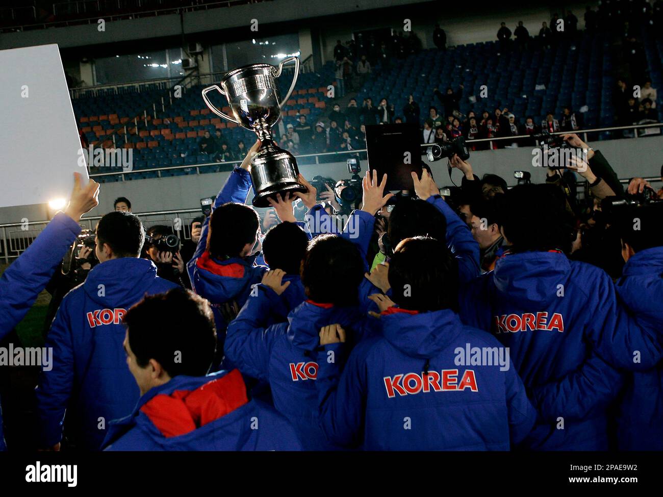 South Korea's players greet the fans of South Korean team at the stand after the award ceremony ...