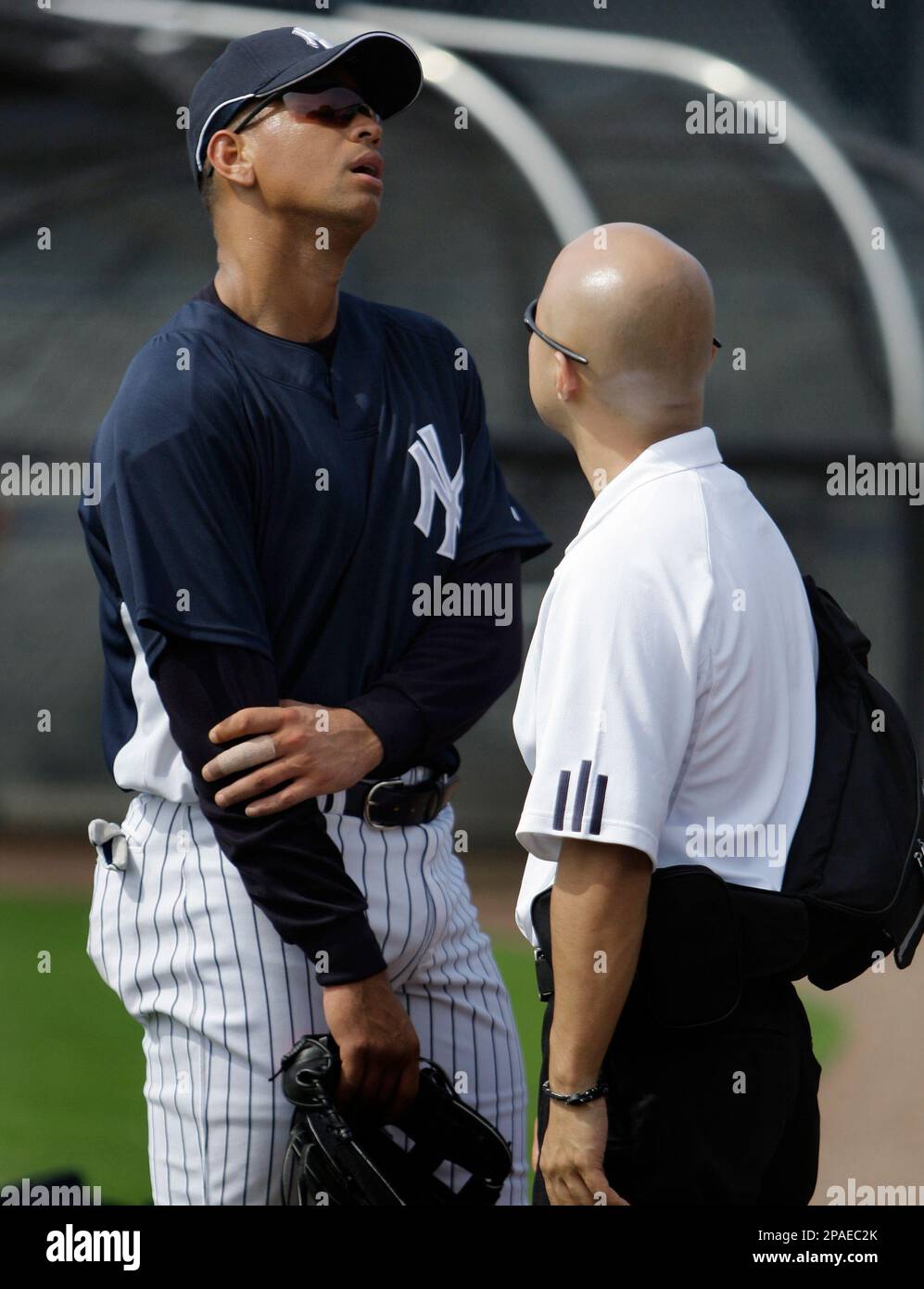 New York Yankees third baseman Alex Rodriguez, left, talks with a ...