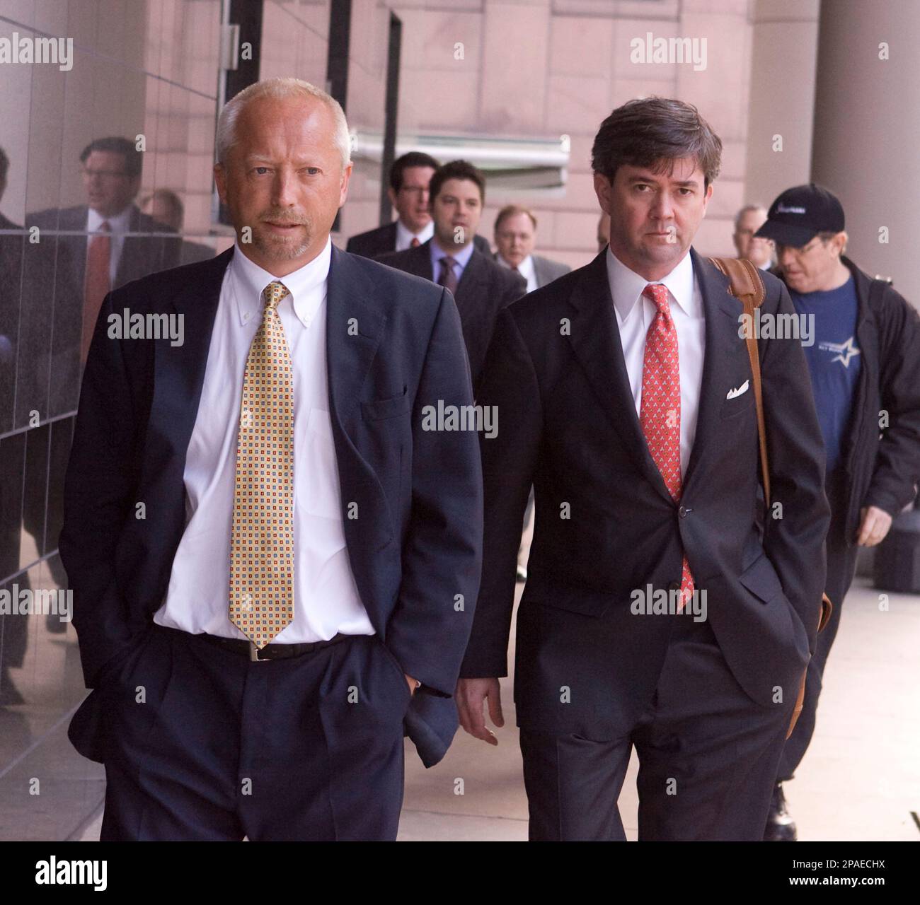 British banker Giles Darby, left, arrives at the Bob Casey Federal ...
