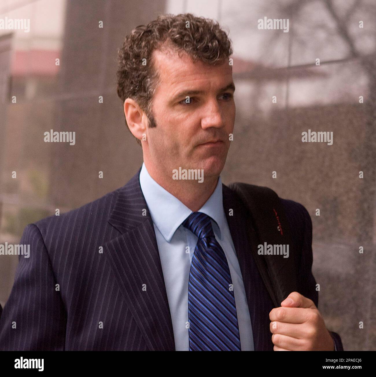 British banker Gary Mulgrew arrives at the Bob Casey Federal Courthouse ...