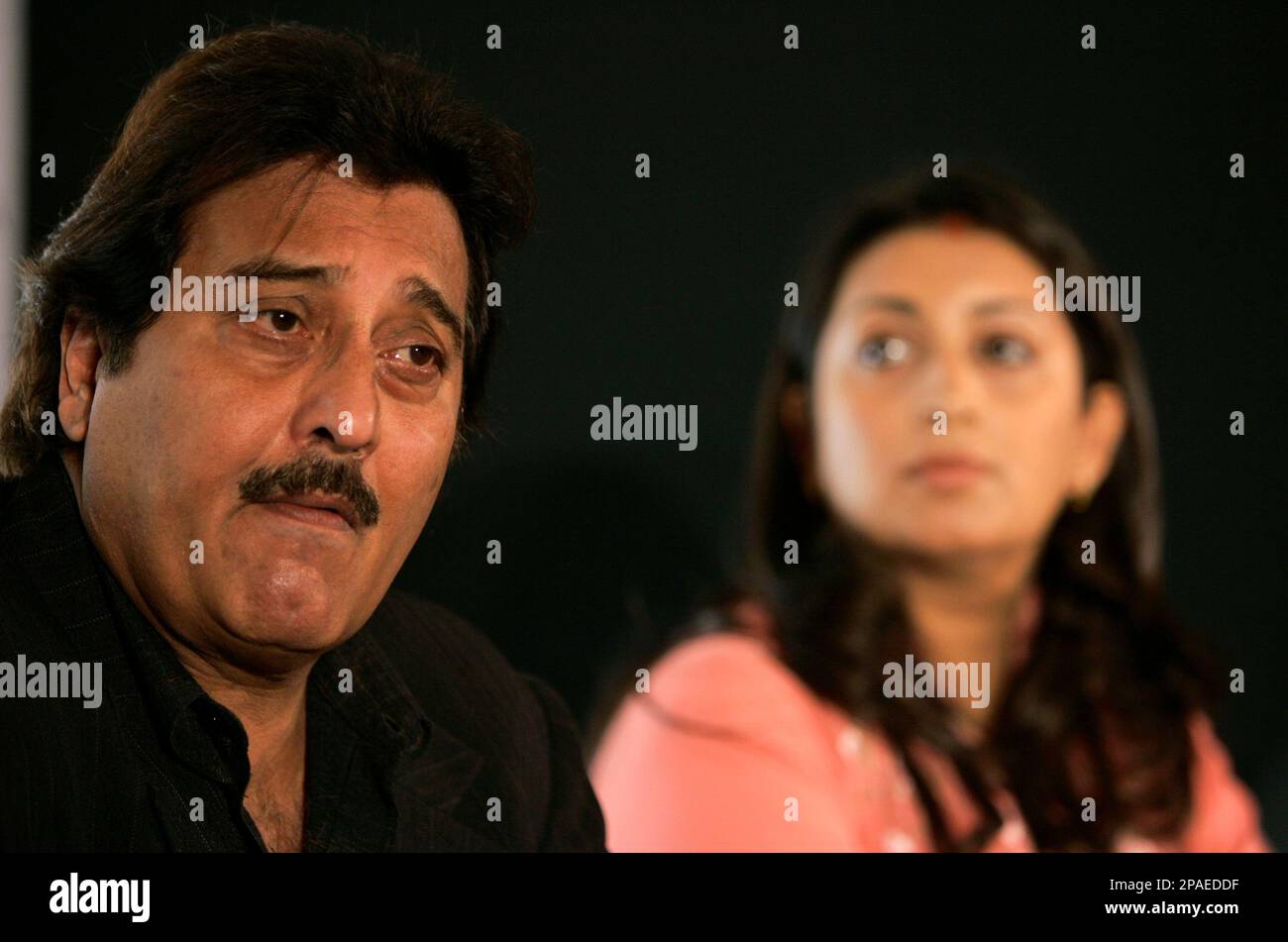Indian actor Vinod Khanna, left, and Smriti Irani, talk to the media ...
