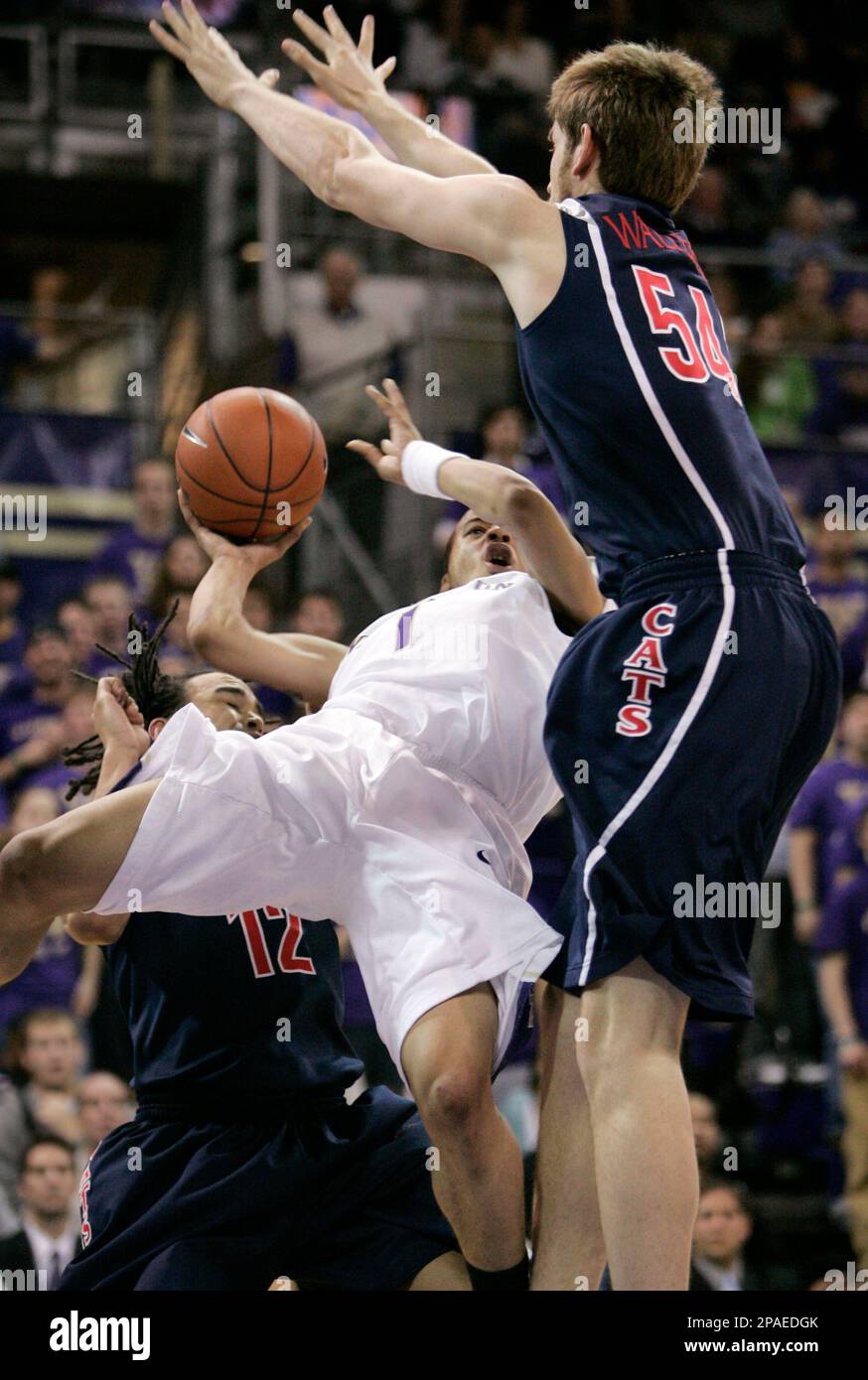 Washington's Venoy Overton (1) puts up an off-balance, shot as Arizona ...