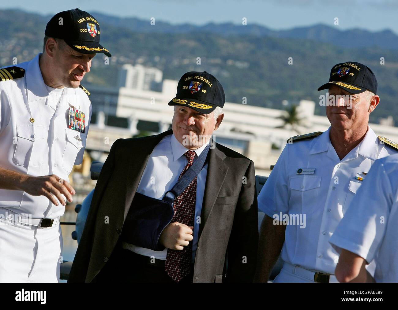 Secretary of Defense Robert Gates, center, Commander Jeffrey Weston ...