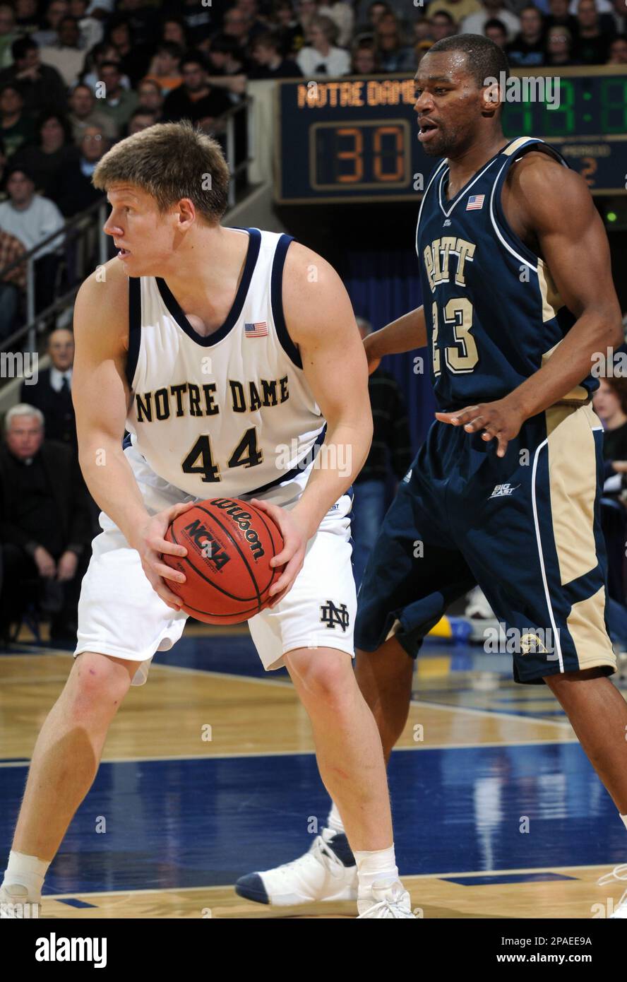 Notre dame forward Luke Harangody, left, gets ready to drive the lane ...