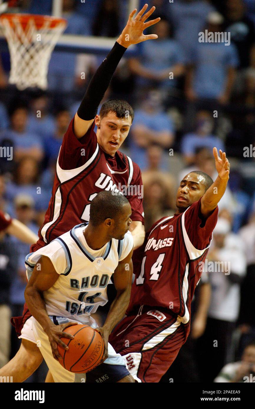 Massachusetts forward Tony Gaffney, top, and guard Chris Lowe, right ...