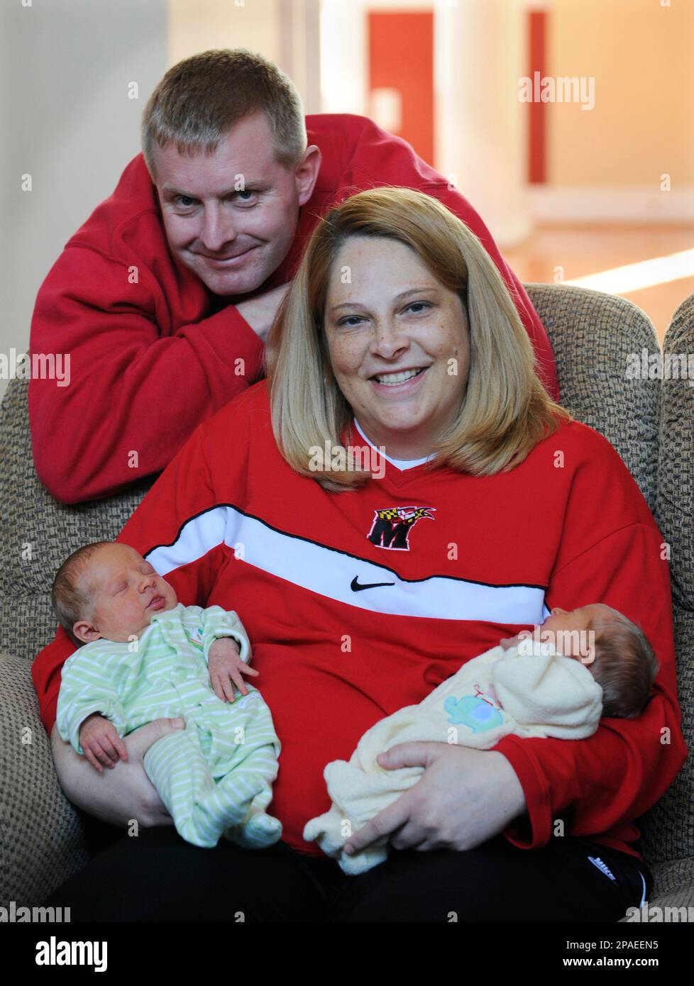 Maryland women's basketball coach Brenda Frese holds her newborn twin ...