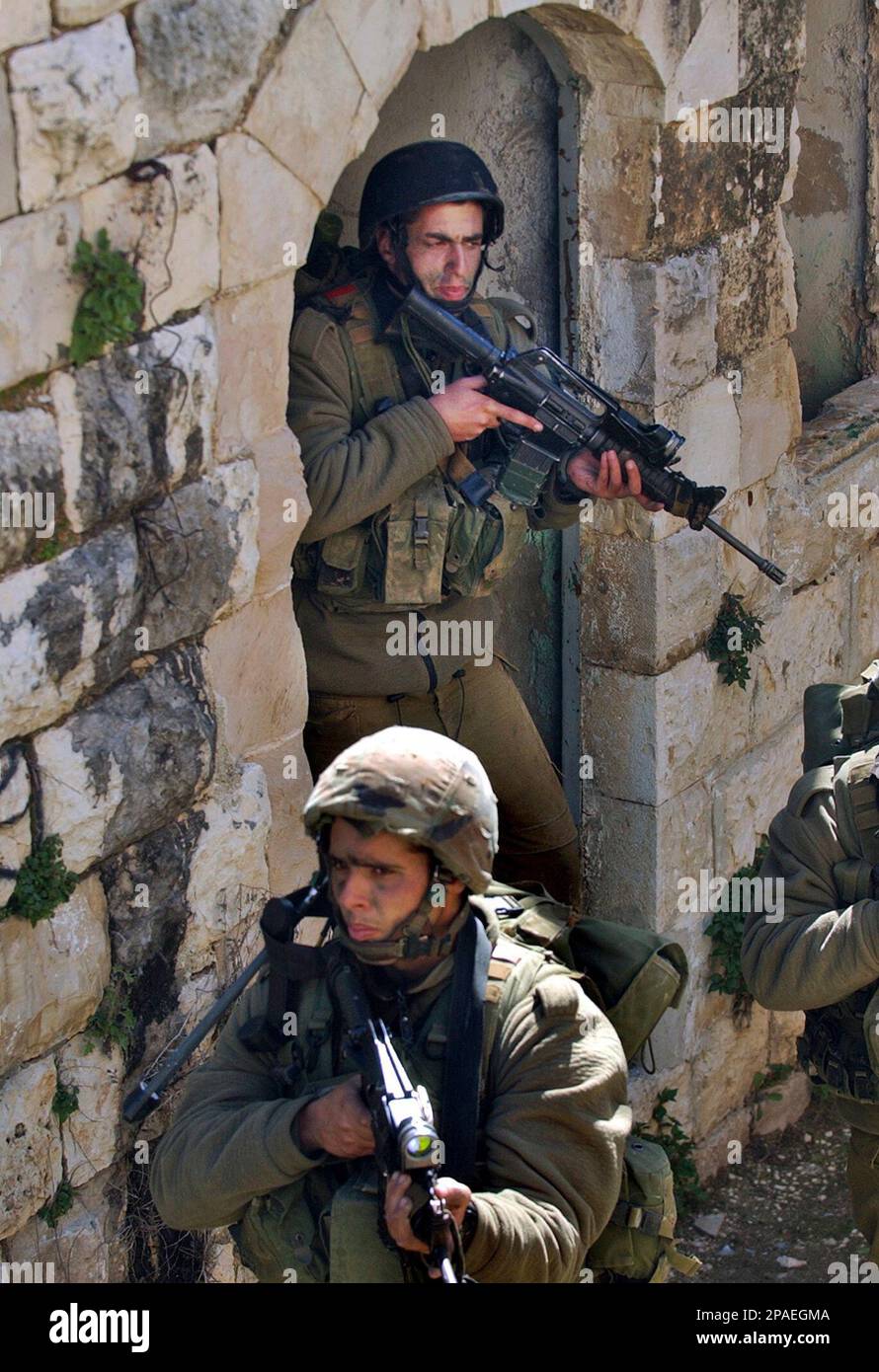 Israeli soldiers take position during a military operation in the West ...
