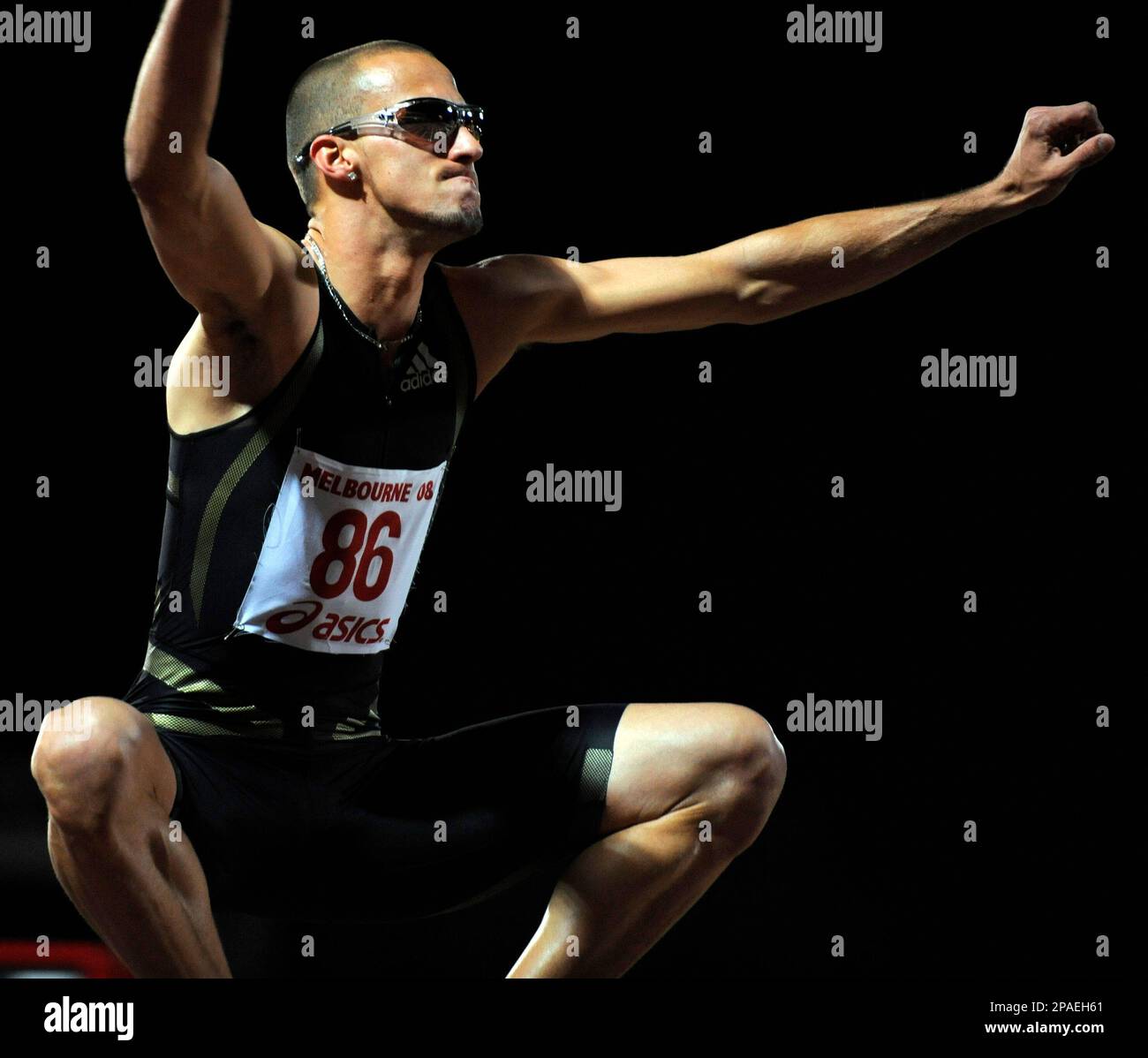 Jeremy Wariner from the United States jumps before the start of the men ...