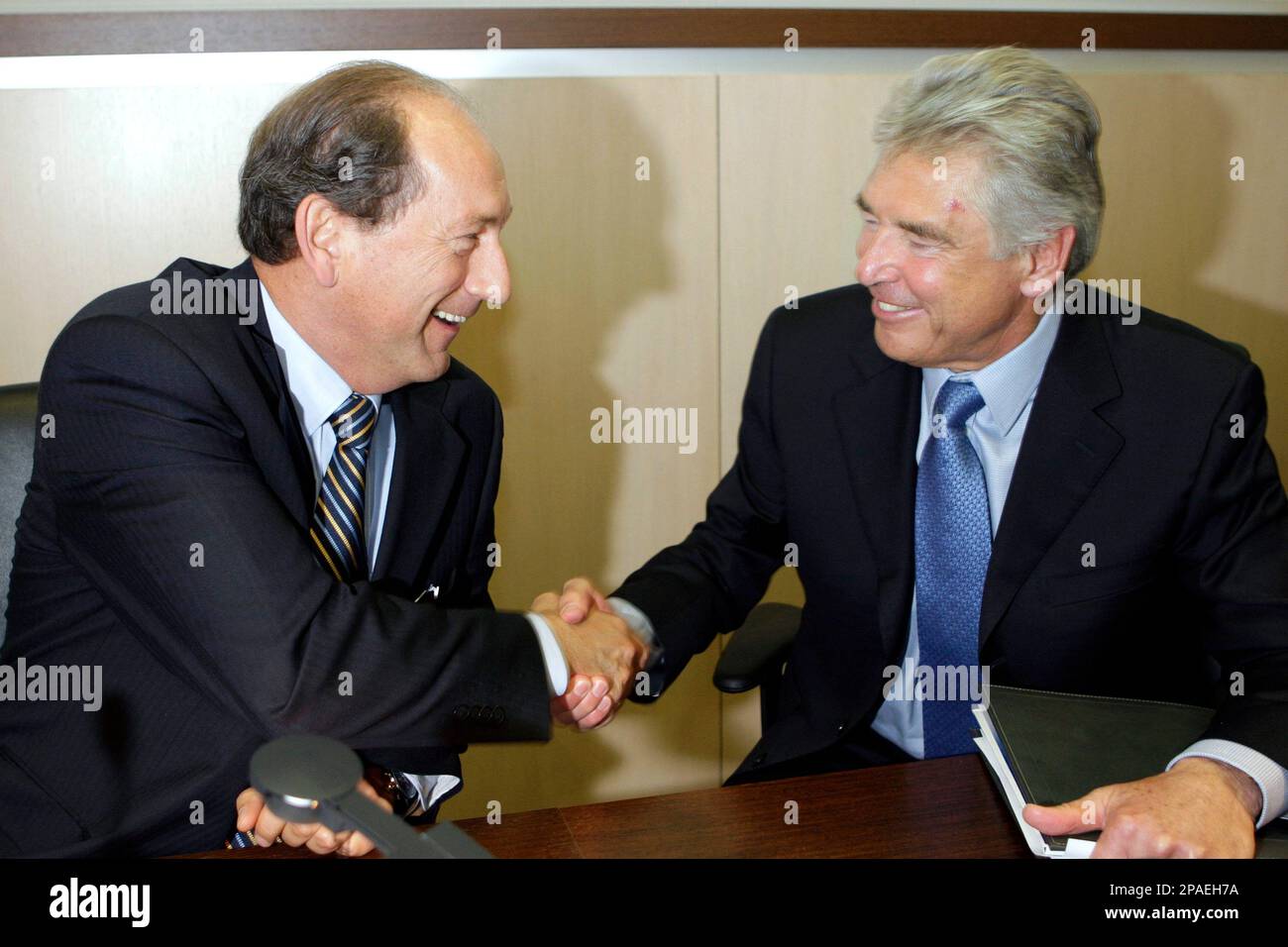 Paul Bulcke, left, CEO designate of Nestle, shakes hands with Nestle's ...