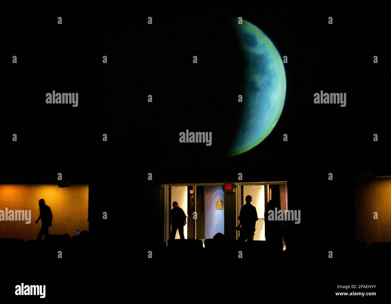 The beginning stages of a total lunar eclipse are projected onto the ...