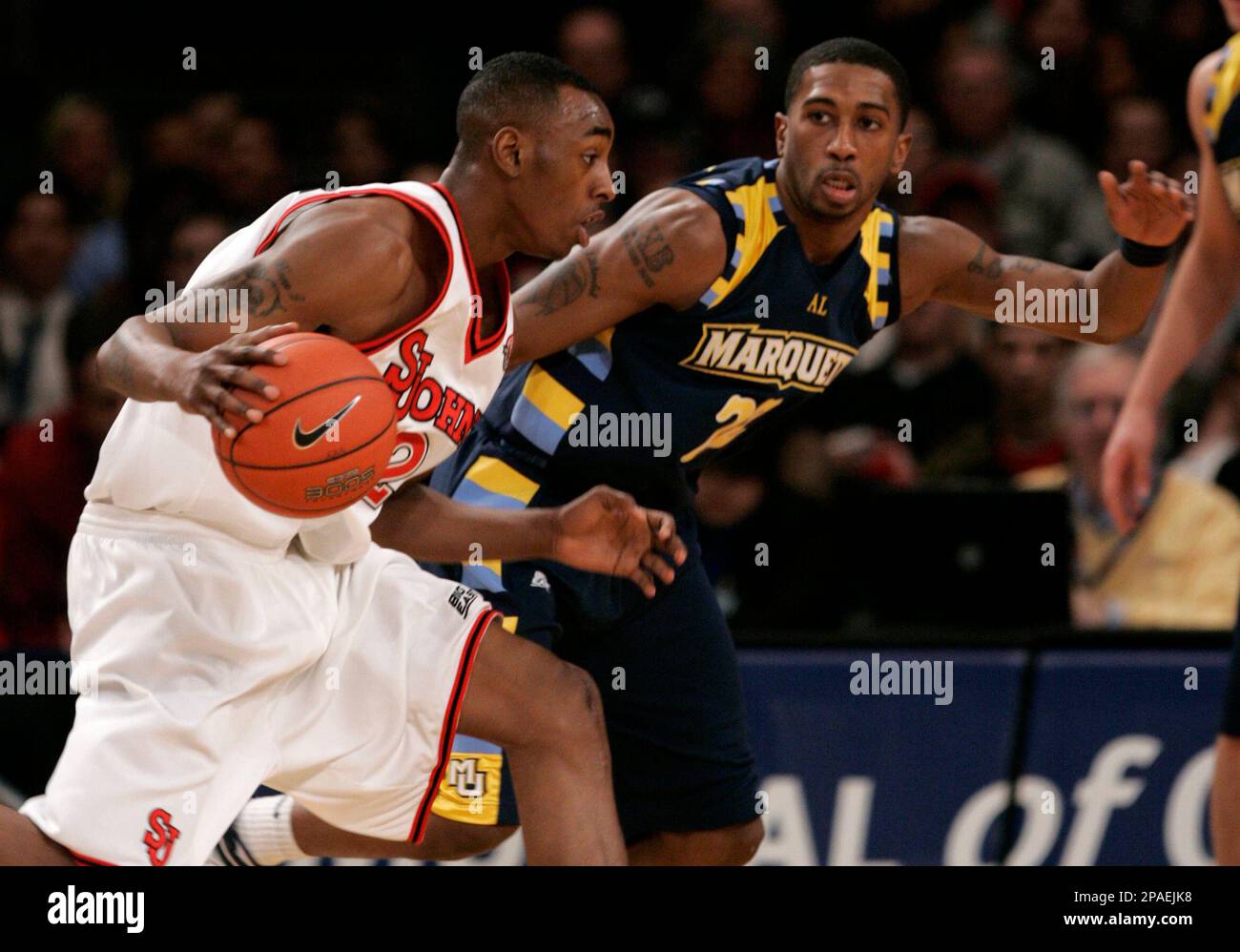 St. John's Anthony Mason (2) is defended by Marquette's Jerel McNeal ...