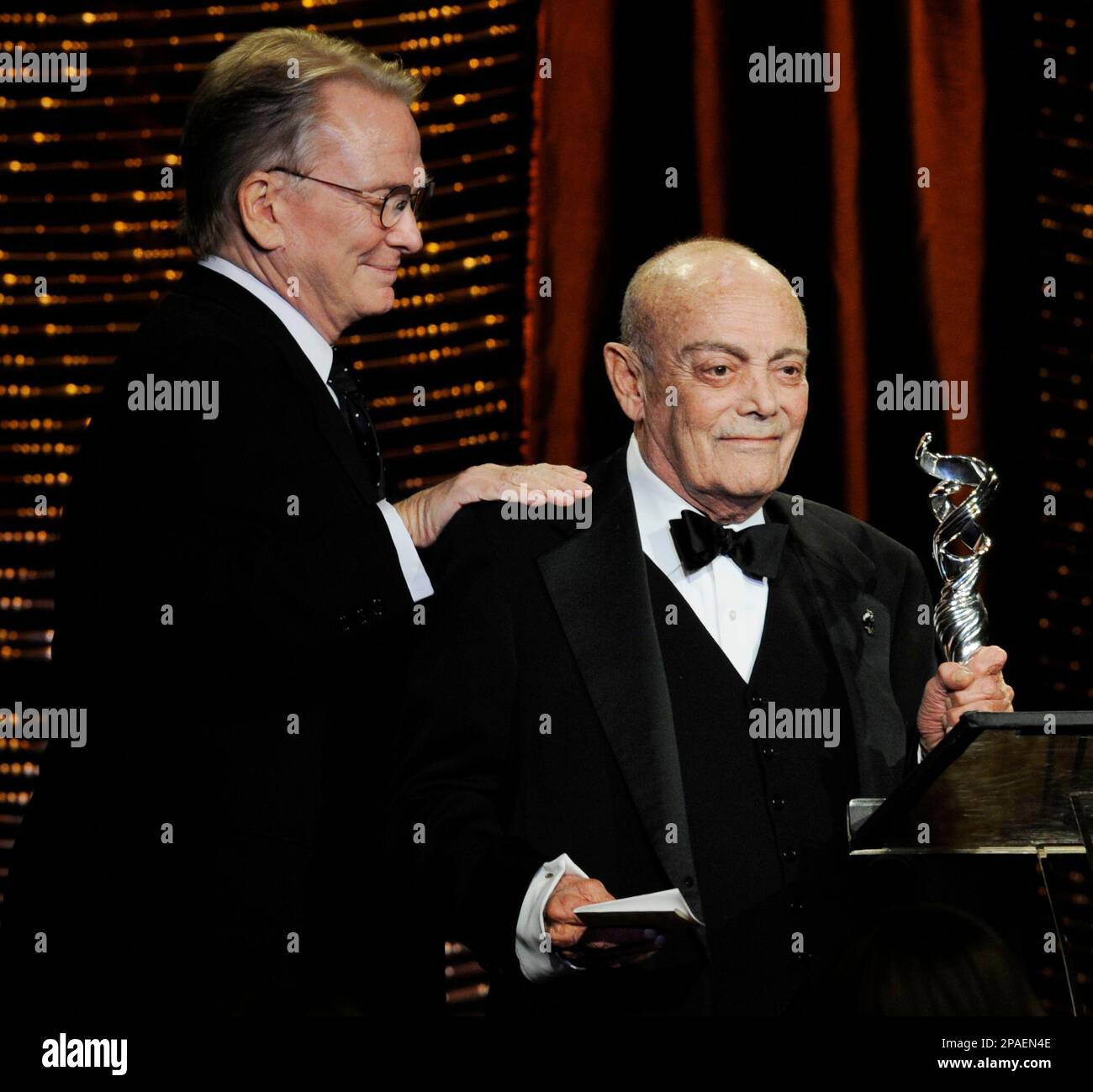 Costume designer Ray Aghayan, right, accepts the Career Achievement in ...
