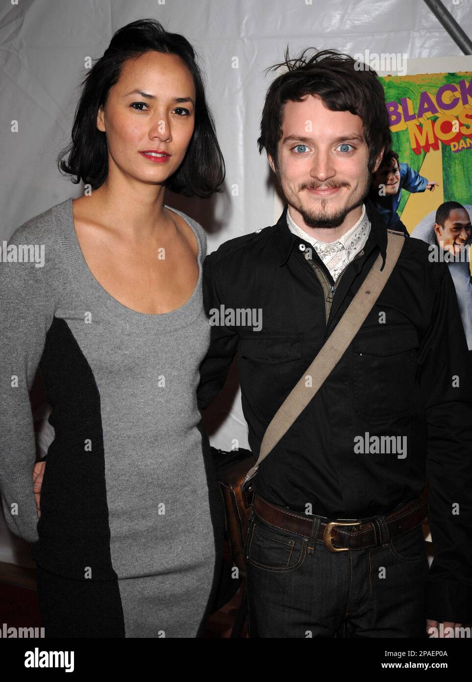 Actor Elijah Wood and Pamela Racine arrive at the premiere of "Be Kind ...