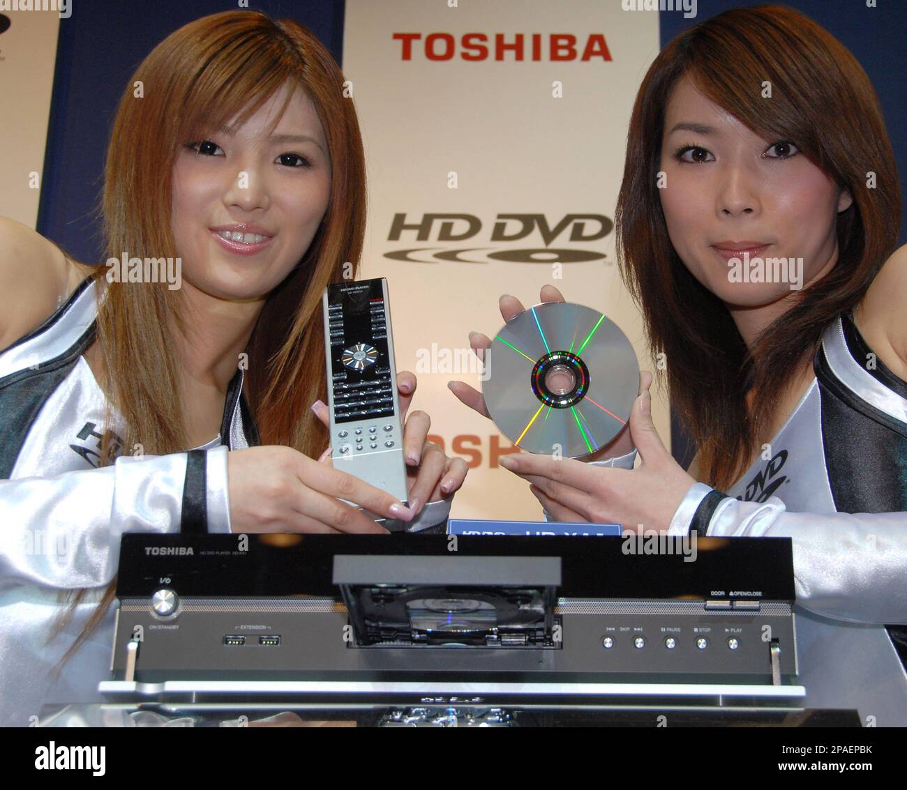 ** FILE ** Models pose with Toshiba's HD-XA1 HD DVD player in Tokyo in this March 31, 2006 file ...