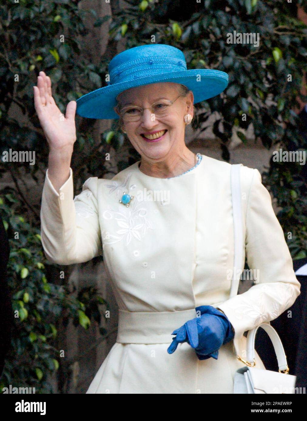 Queen Margrethe II of Denmark waves to photographers after a welcoming ...