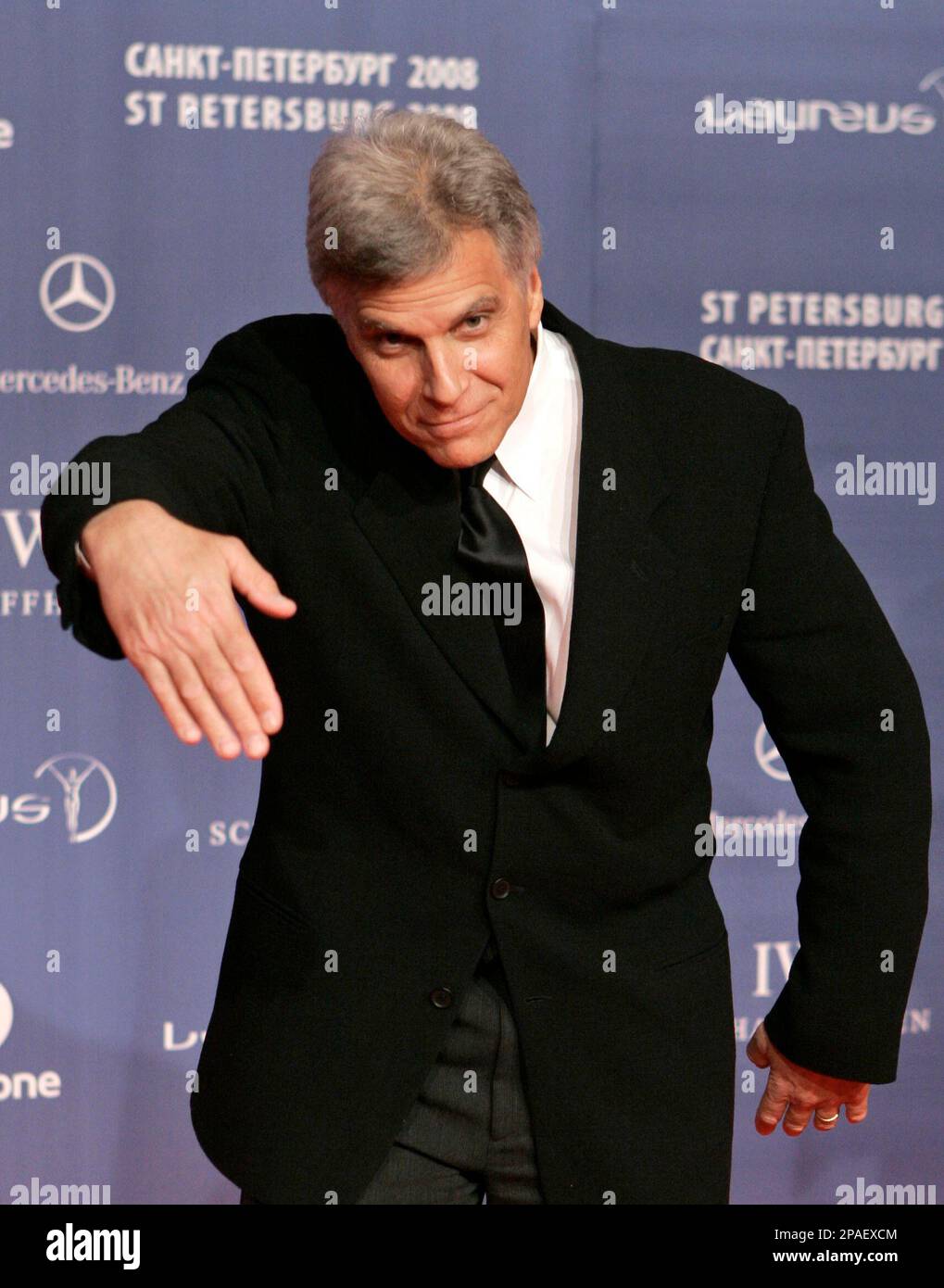 Former U.S. swimmer Mark Spitz jokes as he arrives for the Laureus ...