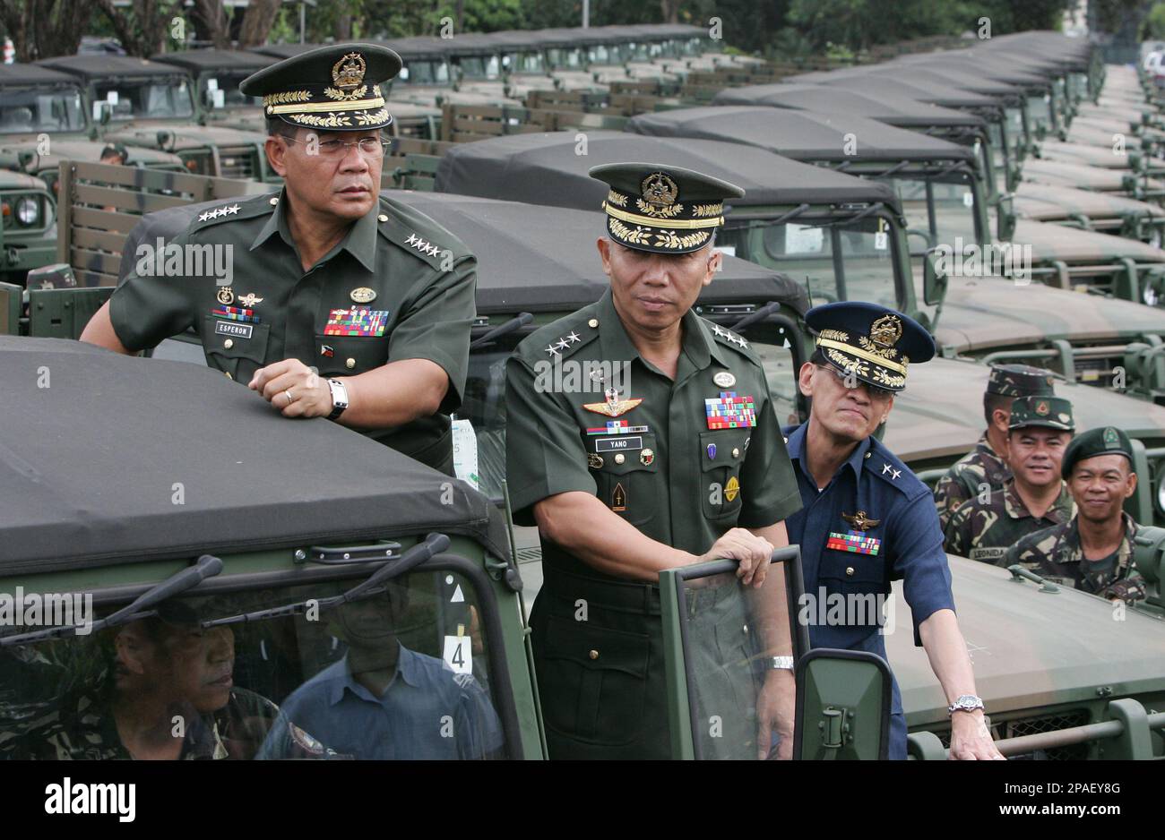 Philippine Armed Forces Chief Gen. Hermogenes Esperon Jr, left, boards ...