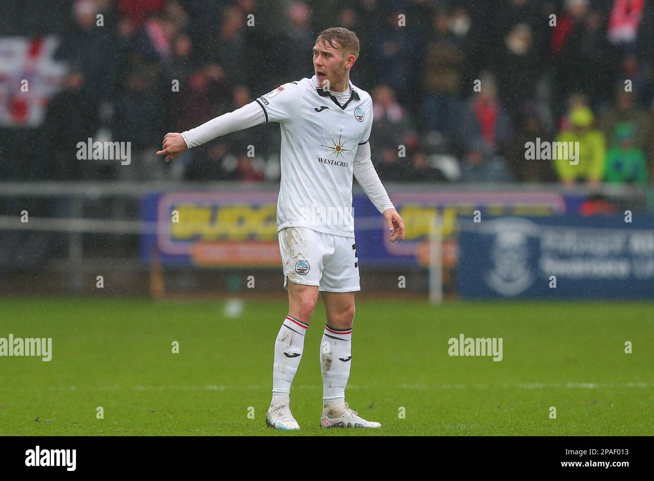 Ollie Cooper #31 of Swansea City gives his teammates instructions ...