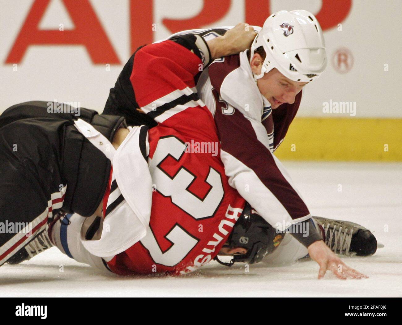 Colorado Avalanche's Cody McLeod, top, fights with Chicago Blackhawks ...