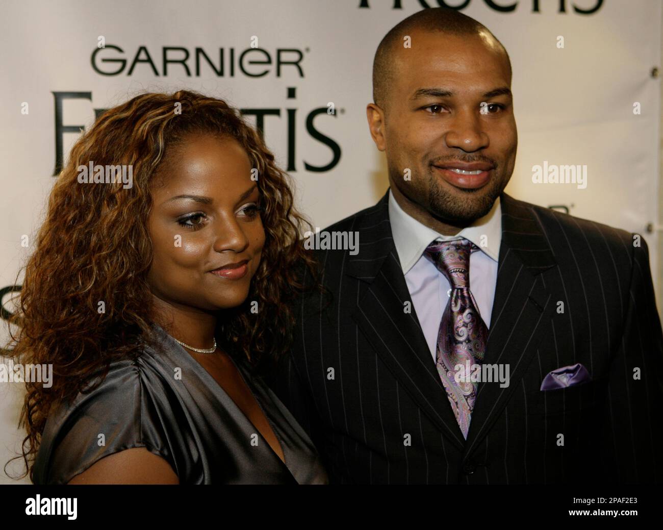 Celebrity Derek Fisher right, with his wife Candice Fisher arrives at ...