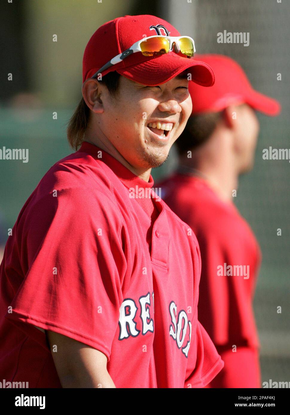 Boston Red Sox pitcher Daisuke Matsuzaka smiles as he takes the field ...