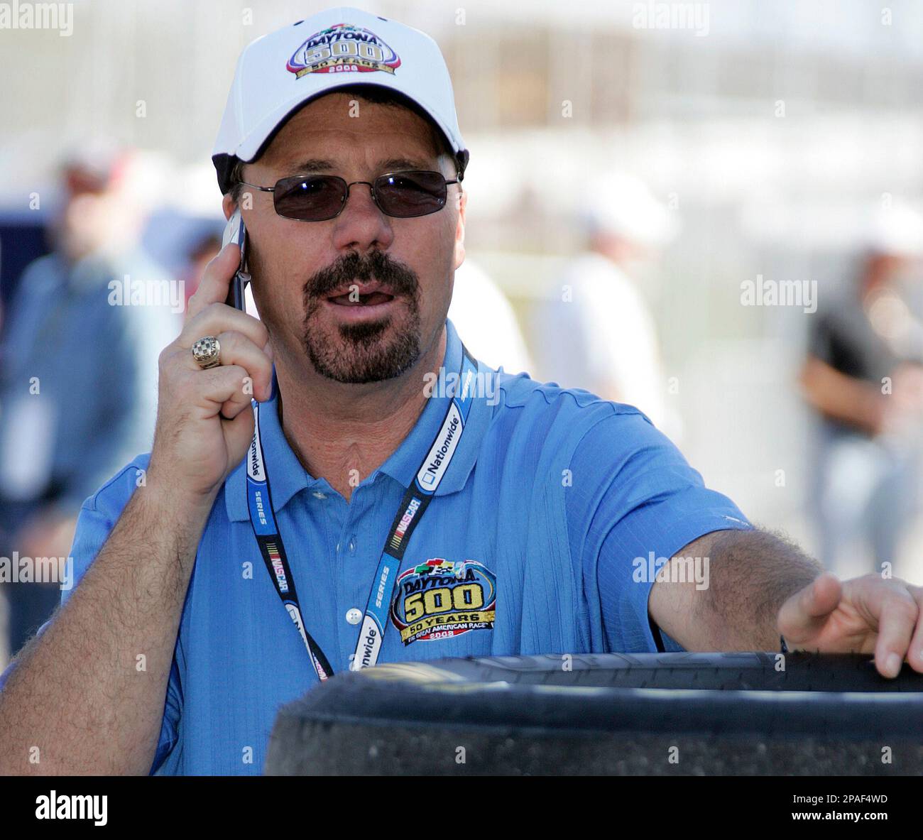 Former NASCAR driver Ernie Irvan visits the garage area during practice ...
