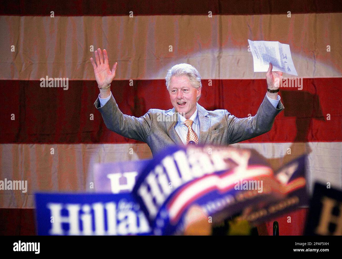 Former President Bill Clinton waves to a crowd of supporters as he ...