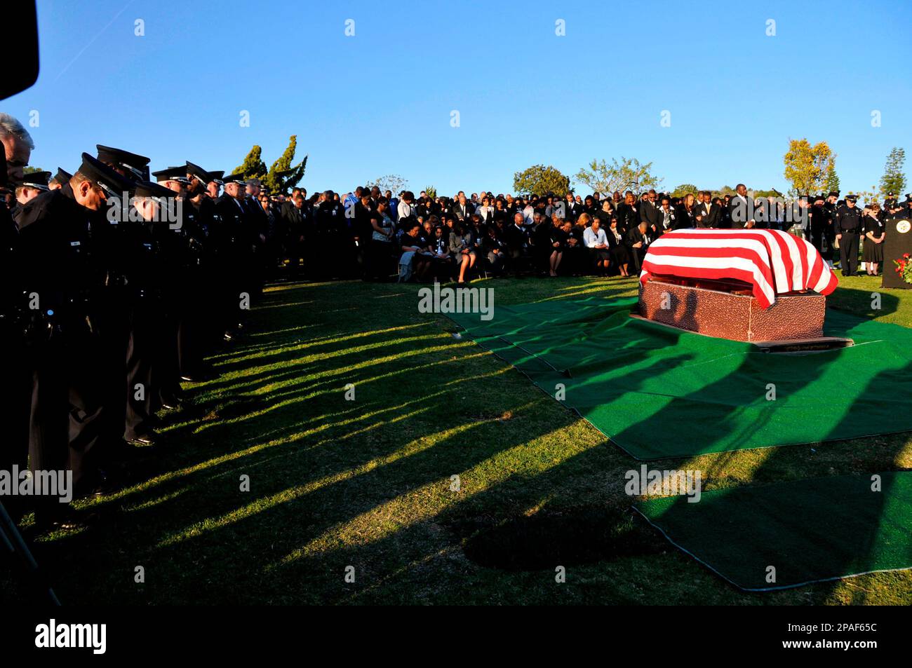 Los Angeles Police Department officers attend a graveside service for ...
