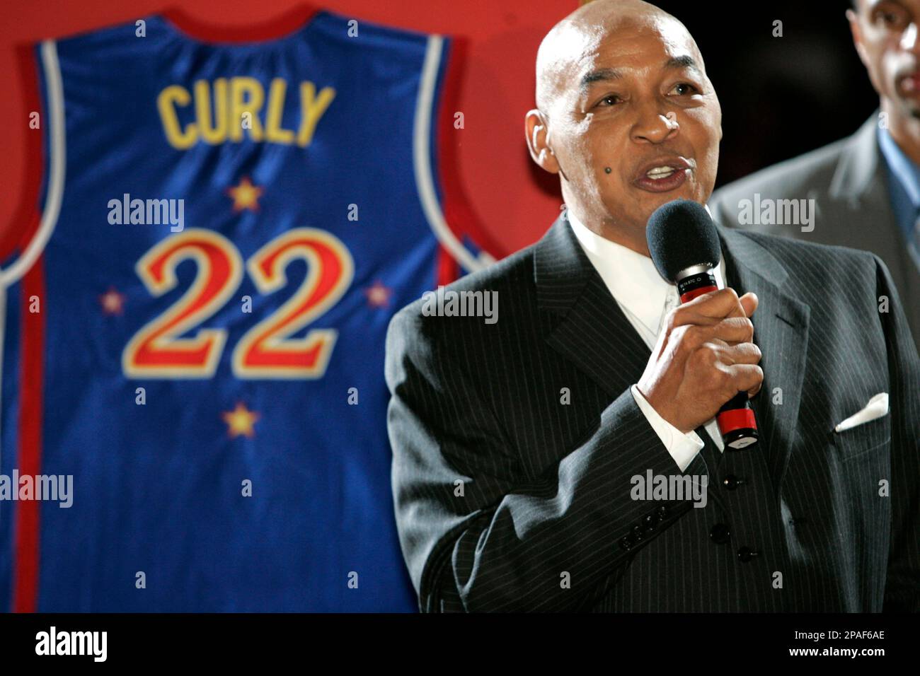 Basketball legend Curly Neal speaks during a ceremony as his No. 22 is ...