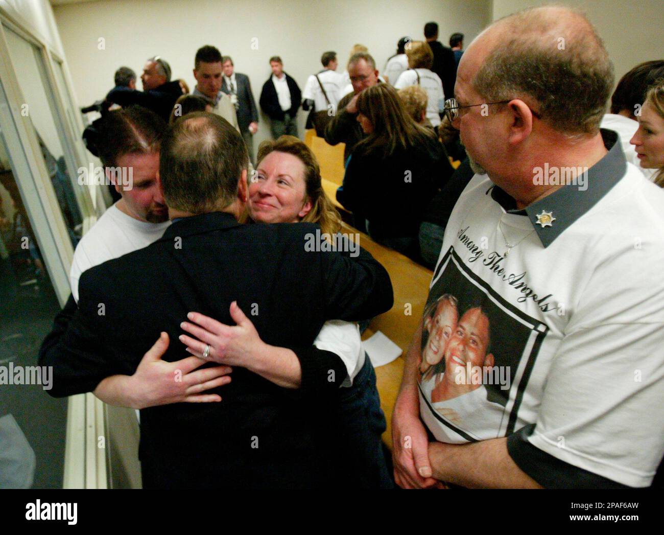 Karen Slater, center, mother of Beverly Mauck, hugs Pierce County ...