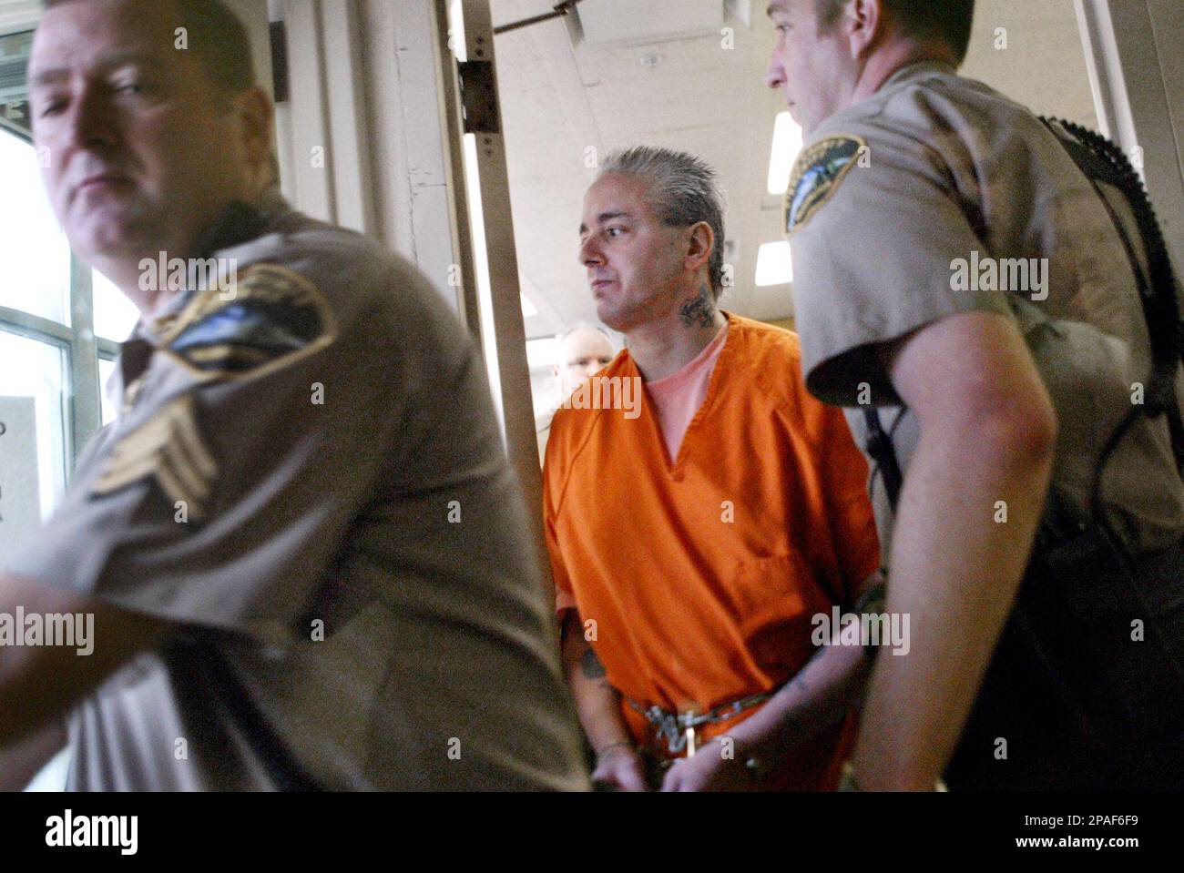Daniel Tavares is led from Pierce County Superior Court in Tacoma, Wash ...