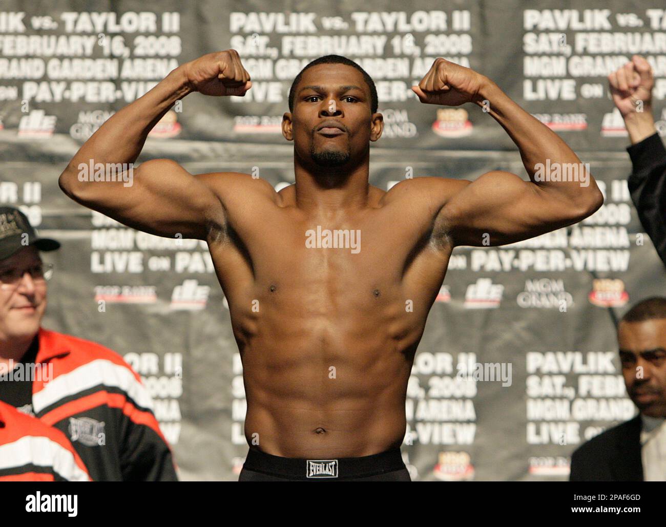Boxer Jermain Taylor flexes his muscles during an official weigh-in ...
