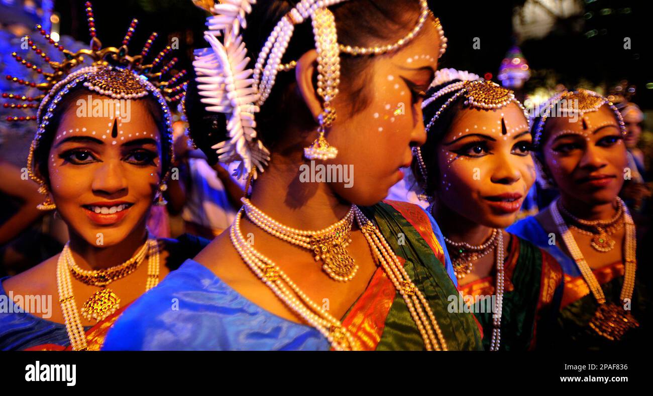 Dancers dressed in traditional Indian costumes are seen during the ...