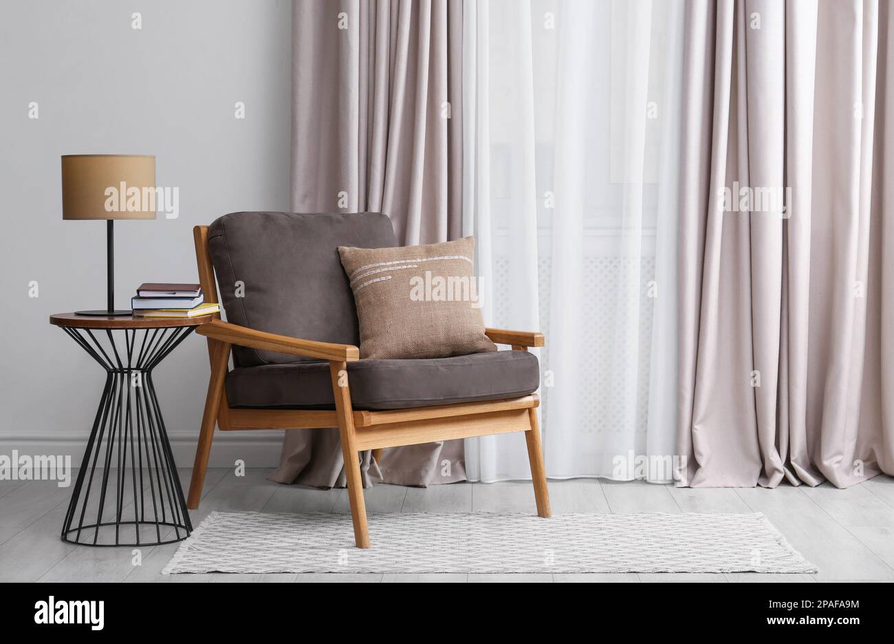 Comfortable armchair and near window in living room. Interior design ...