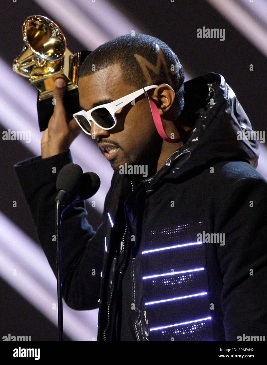 Kanye West accepts the award for best rap album for Graduation at the ...