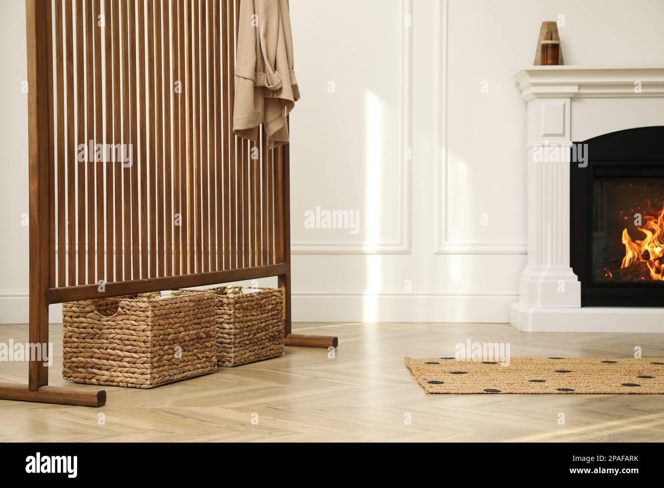 Stylish room with folding screen and fireplace. Interior design Stock ...