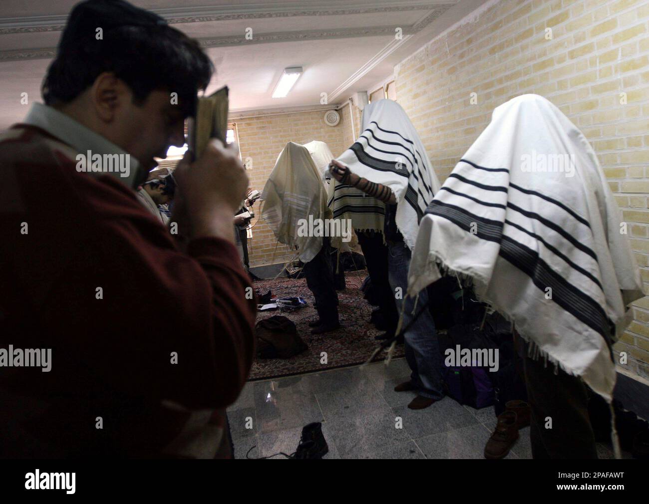 Iranian Jewish men perform morning prayer in Susa, 770 kilometers (460 ...