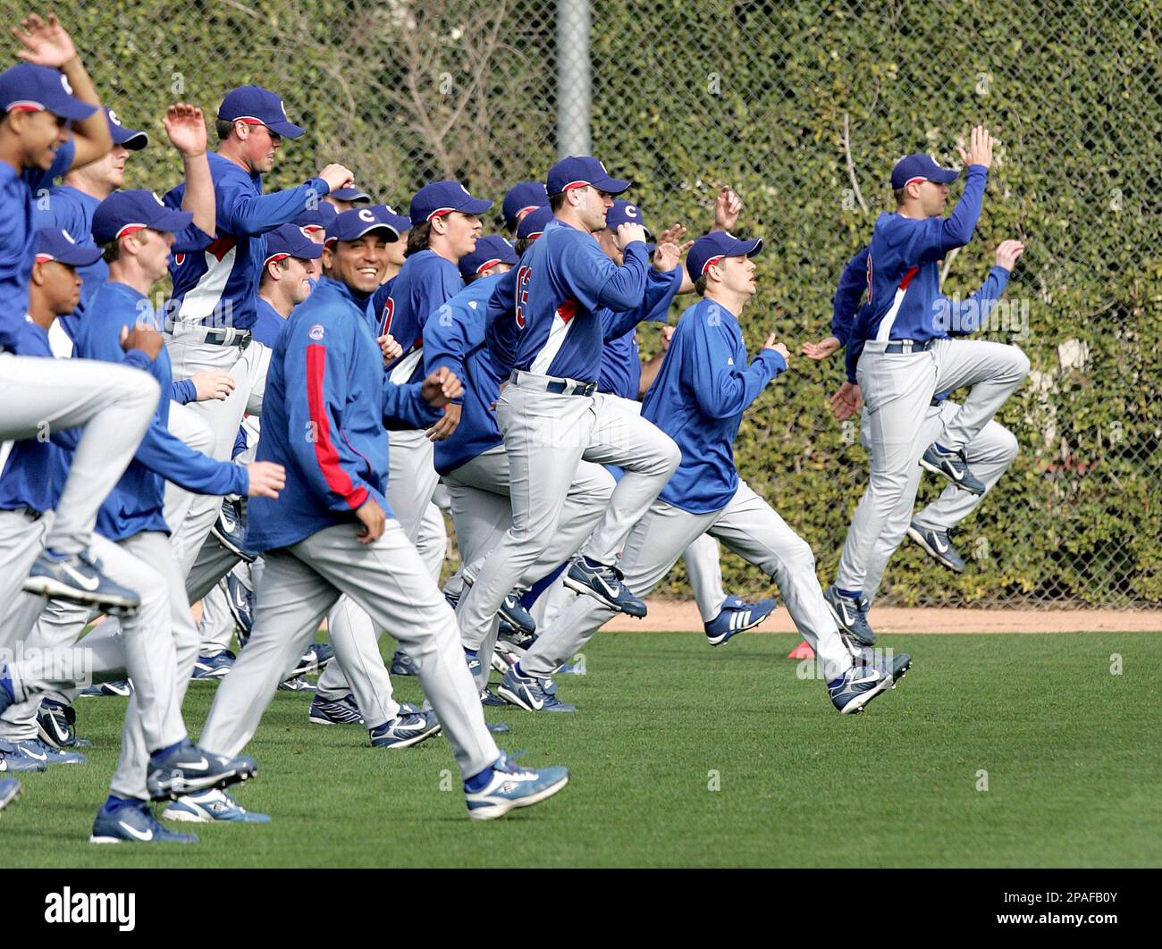Pitchers and catchers with the Chicago Cubs take the field for ...