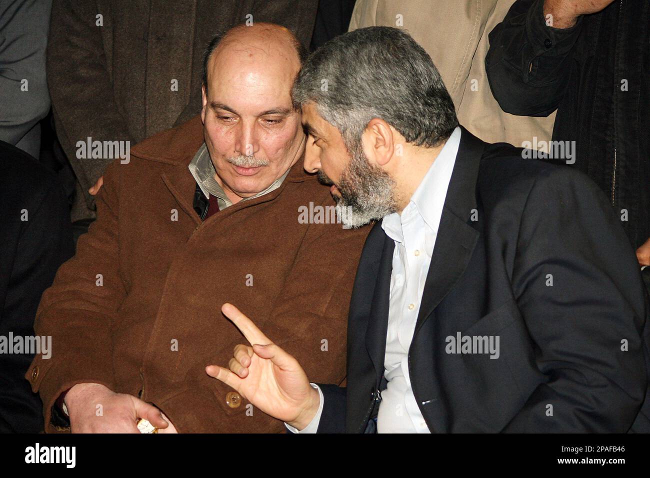 Hamas Political leader Khaled Mashaal, right, and Maher Taher, left ...