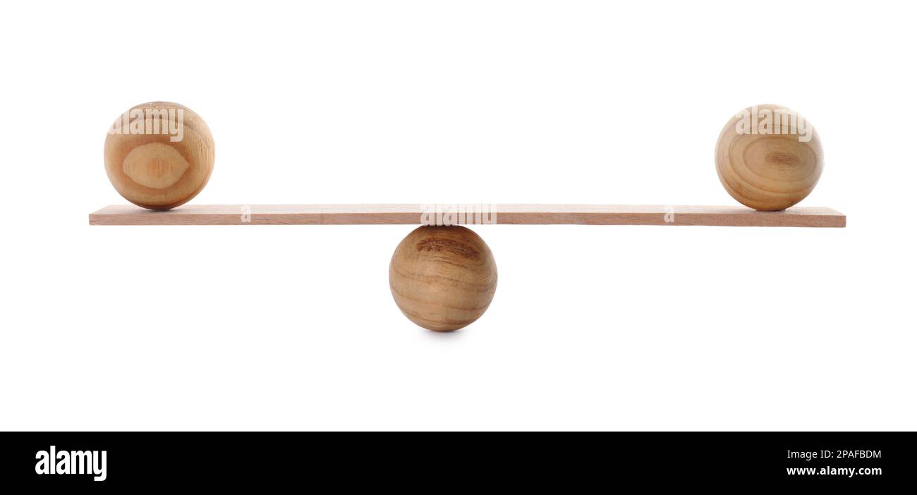 Small plank with wooden balls on white background. Harmony and balance ...