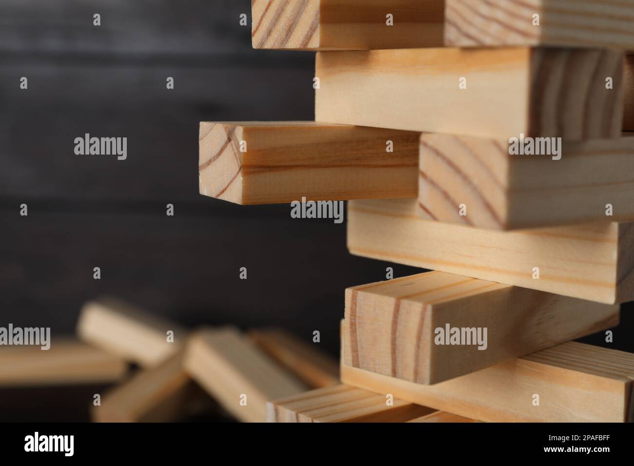 Jenga tower made of wooden blocks on blurred background, closeup Stock ...