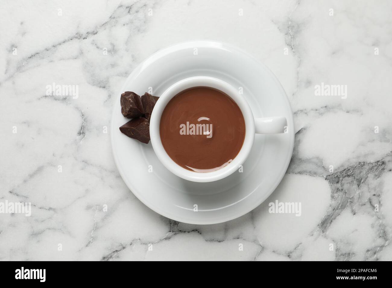 Yummy hot chocolate in cup on white marble table, top view Stock Photo ...