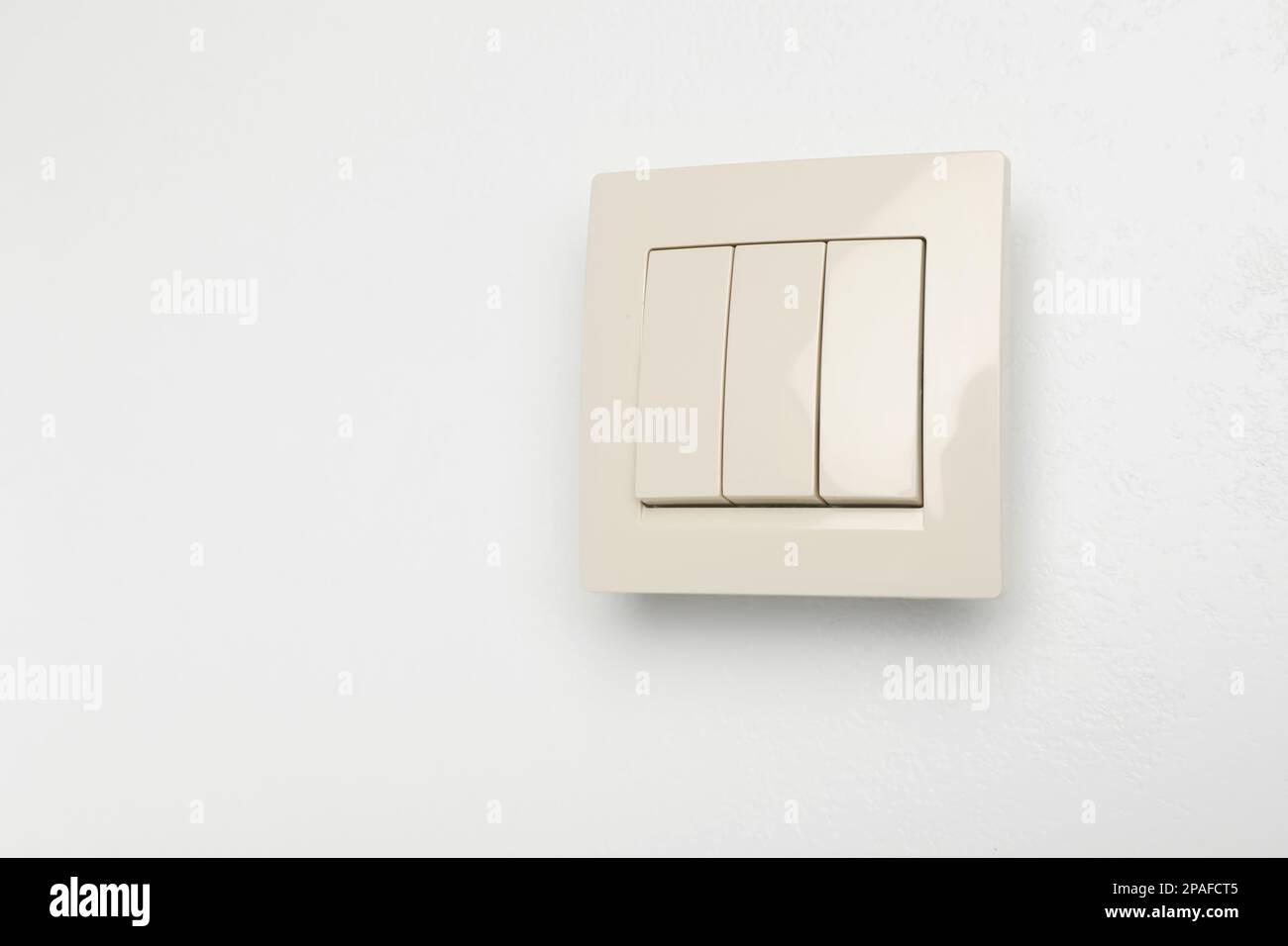 Modern light switch on white background. Space for text Stock Photo - Alamy