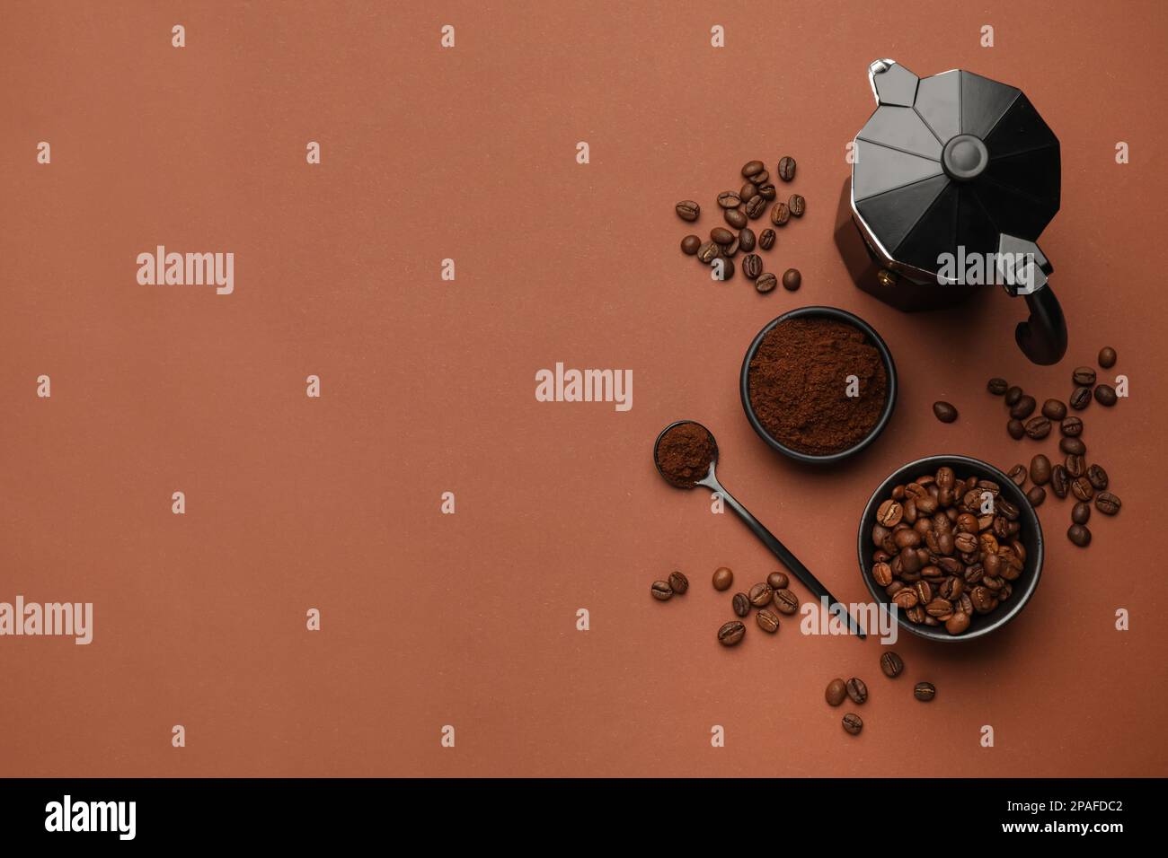 Flat lay composition with coffee grounds and roasted beans on brown ...