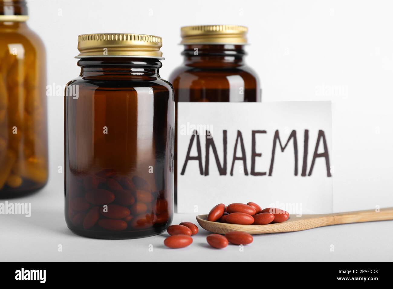 Card with word Anaemia and pills on light background Stock Photo - Alamy