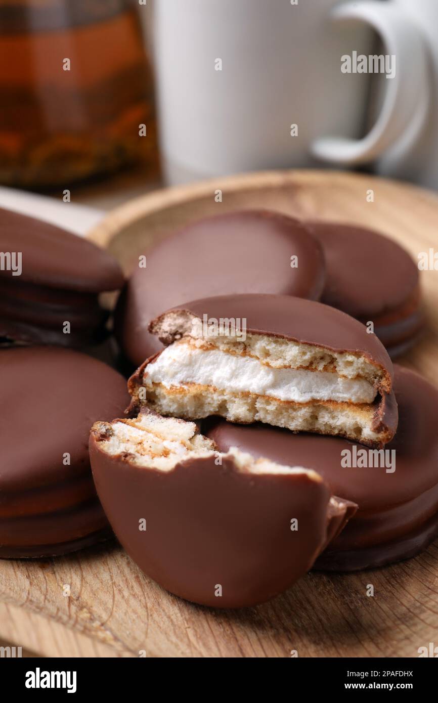 Tasty choco pies on wooden plate, closeup view Stock Photo - Alamy