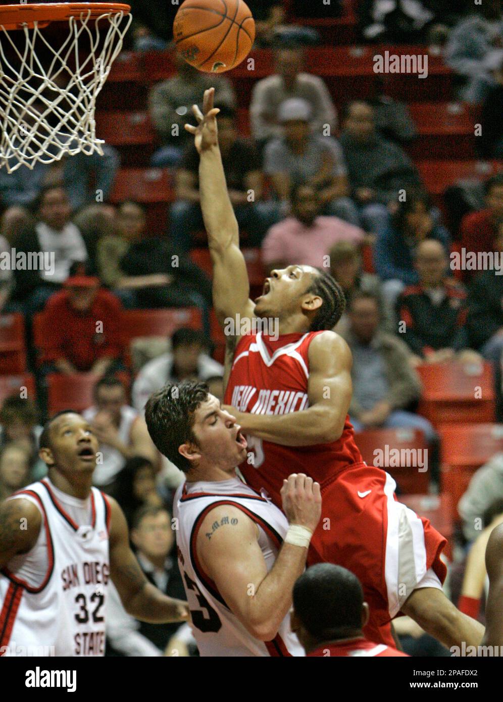 New Mexico's Dairese Gary scores over San Diego State's Ryan Amoroso ...